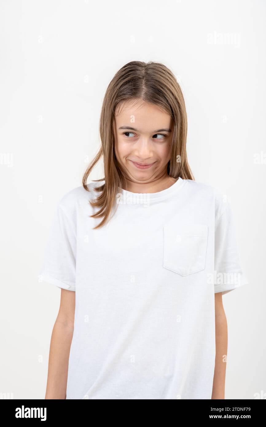 Funny teenage girl smiles shyly on a white background isolated Stock ...