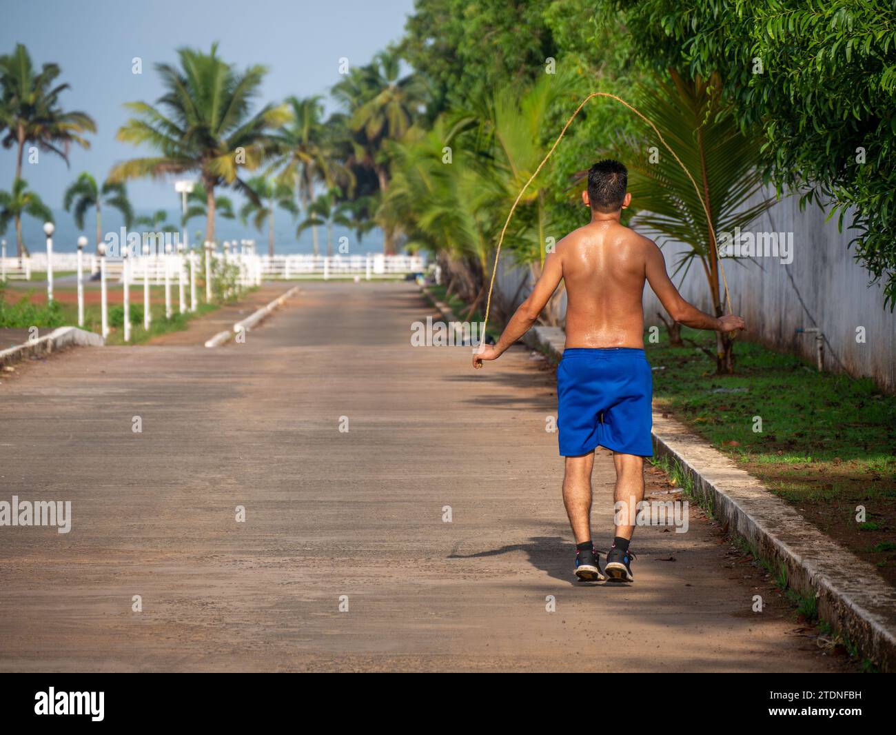 Goa, India - May 22, 2022: Indian man doing jumps with skipping rope ...