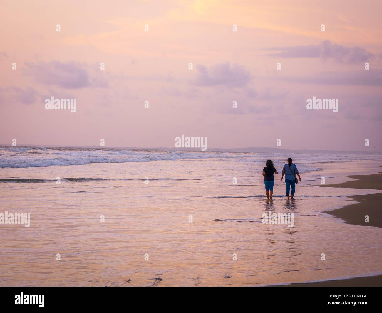Goa, India - May 22, 2022: Back view of asian women walking by beach at ...
