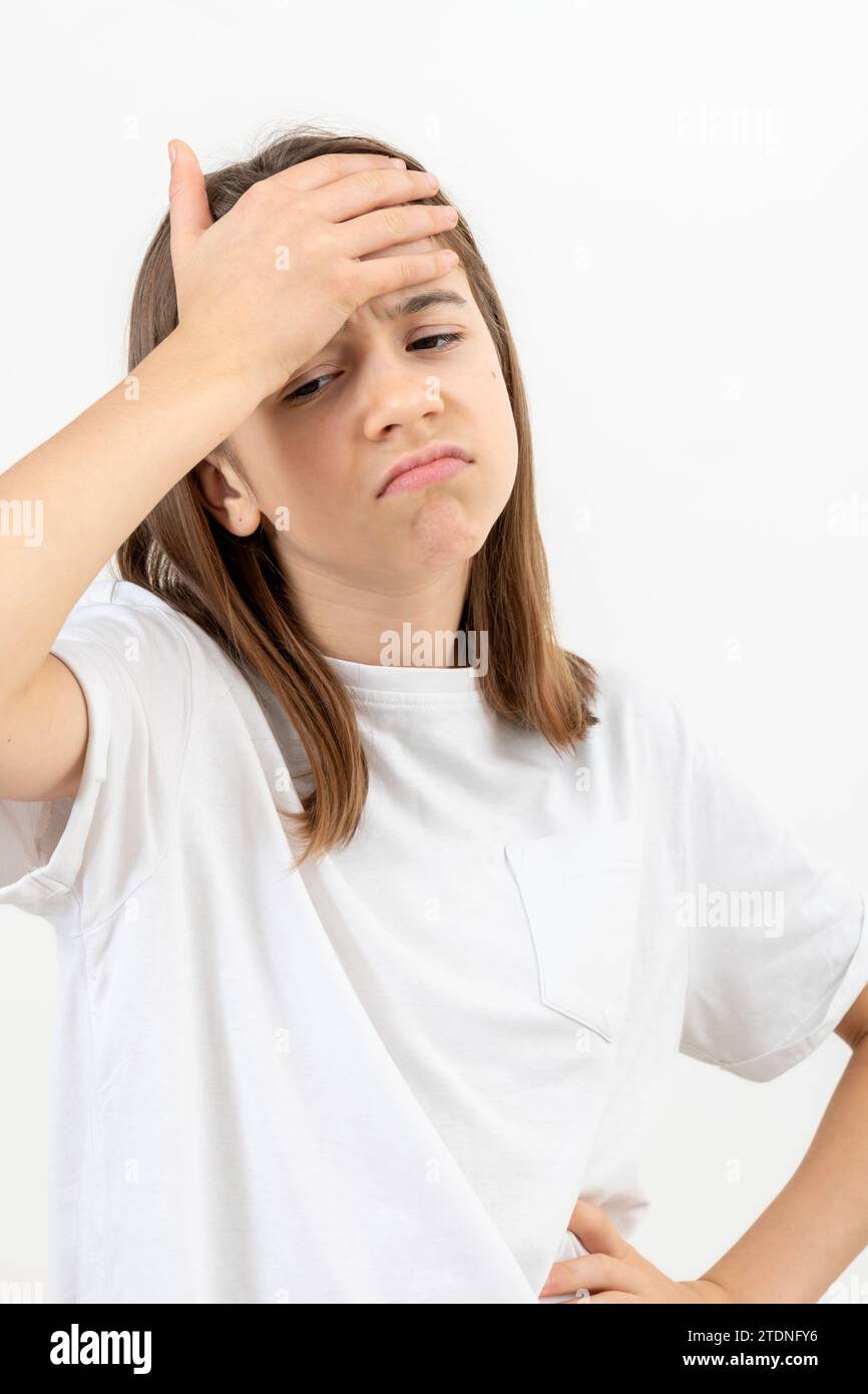 Sad girl touches her forehead with her hand, disappointment and despair ...