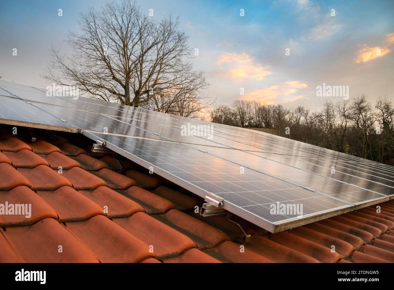 Photovoltaic solar panel installed on a roof Stock Photo - Alamy