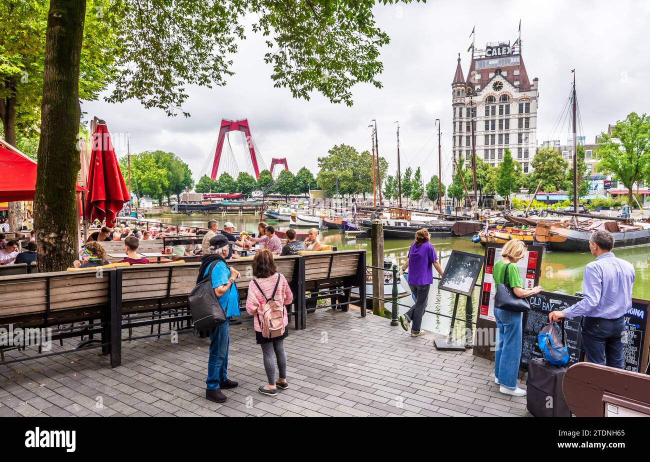 Tourists enjoy the sidewalk cafes and sight over the Old Port of ...
