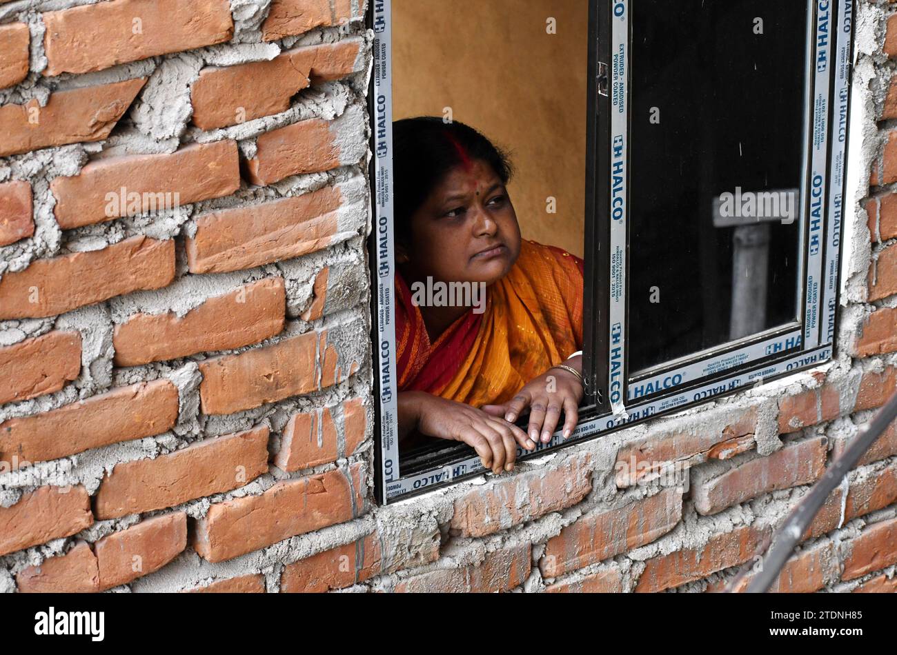 Guwahati, Guwahati, India. 19th Dec, 2023. A woman looks through the ...