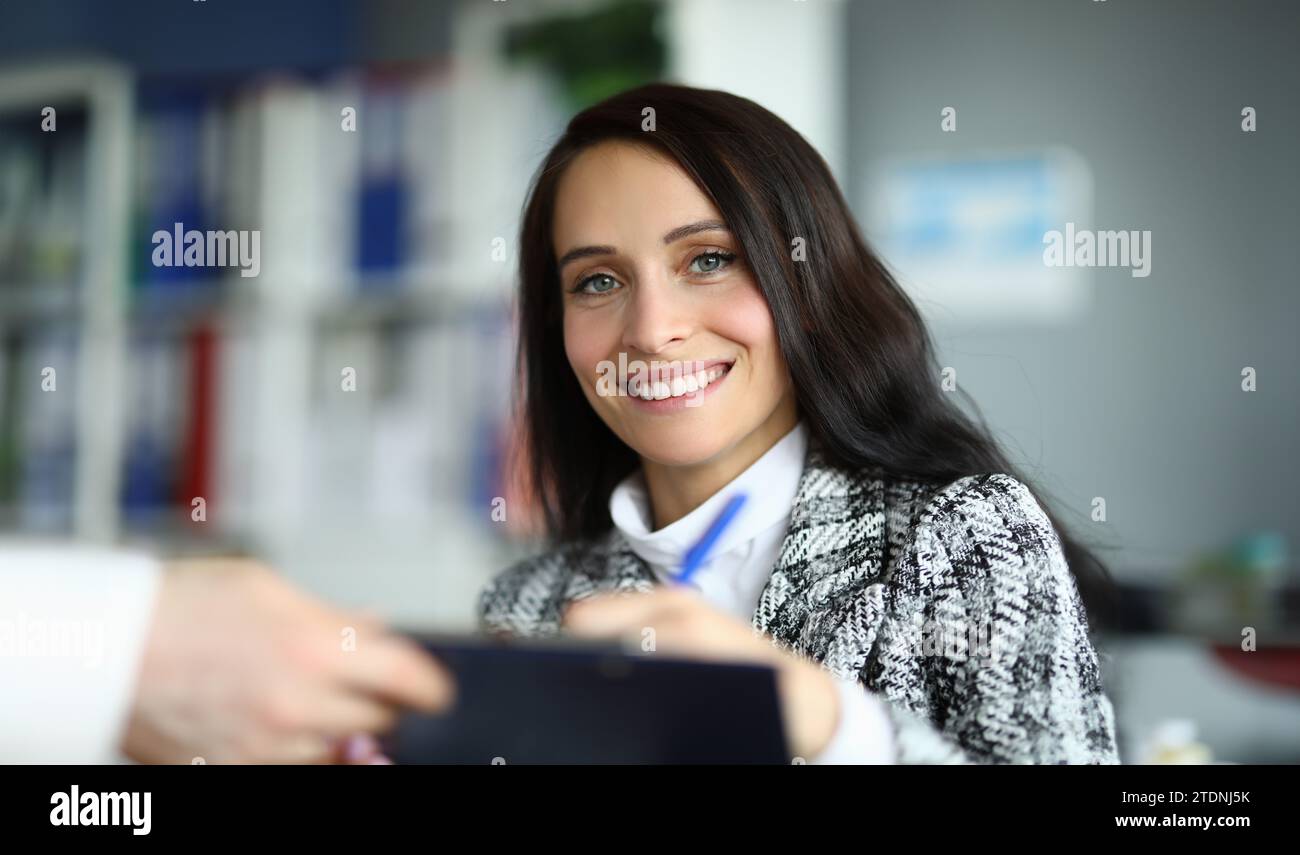 Good-looking employee in grey costume Stock Photo - Alamy