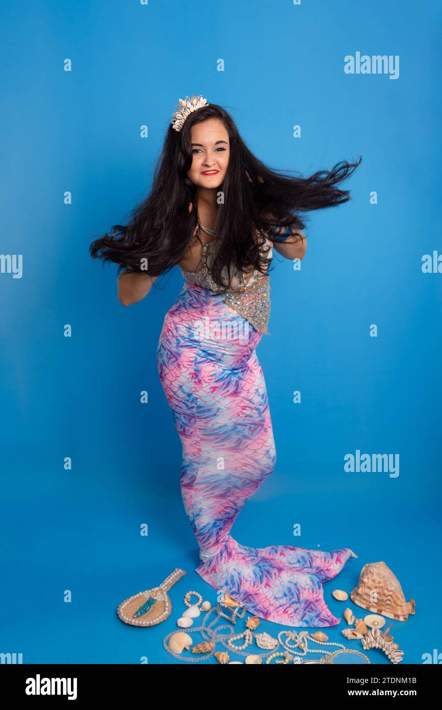 Beautiful woman, wearing a tiara and bracelets made of sea shells ...