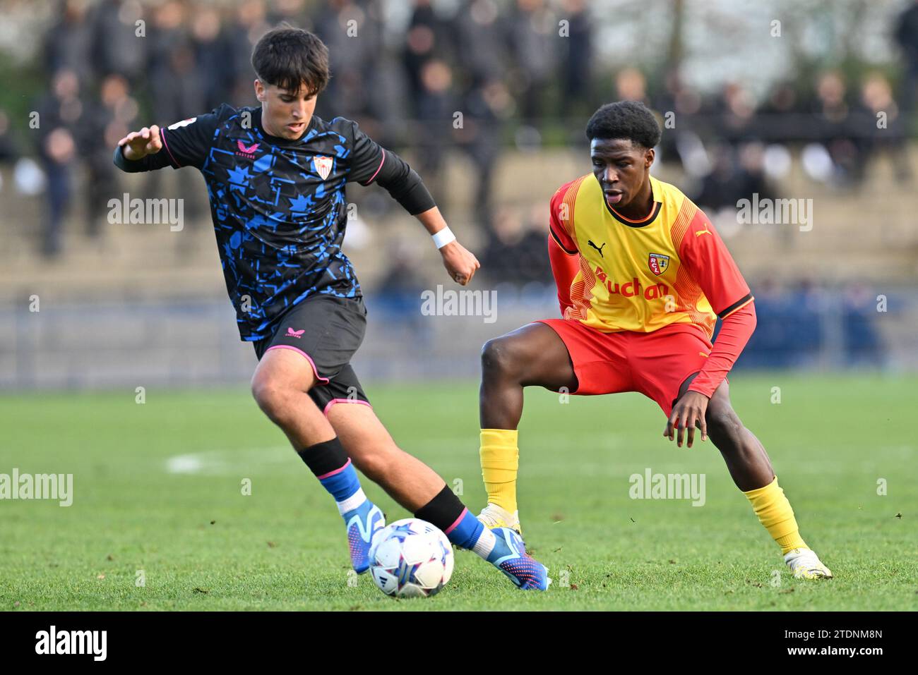 Jesus Acuna Miguez (16) of Sevilla fighting for the ball with Alpha Bah ...