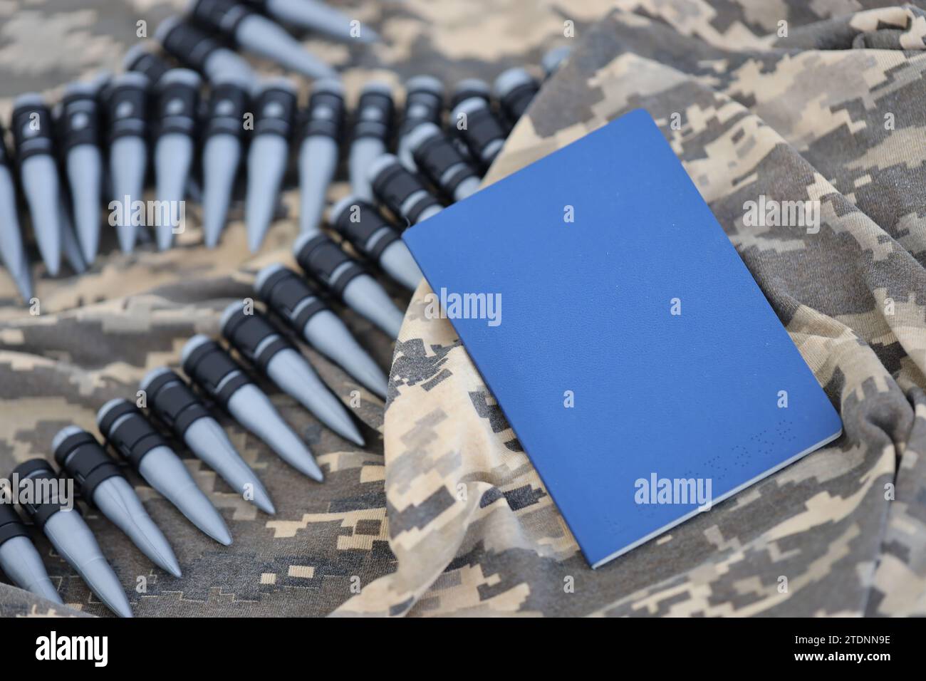 Ukrainian foreign passport on fabric with texture of military pixeled ...