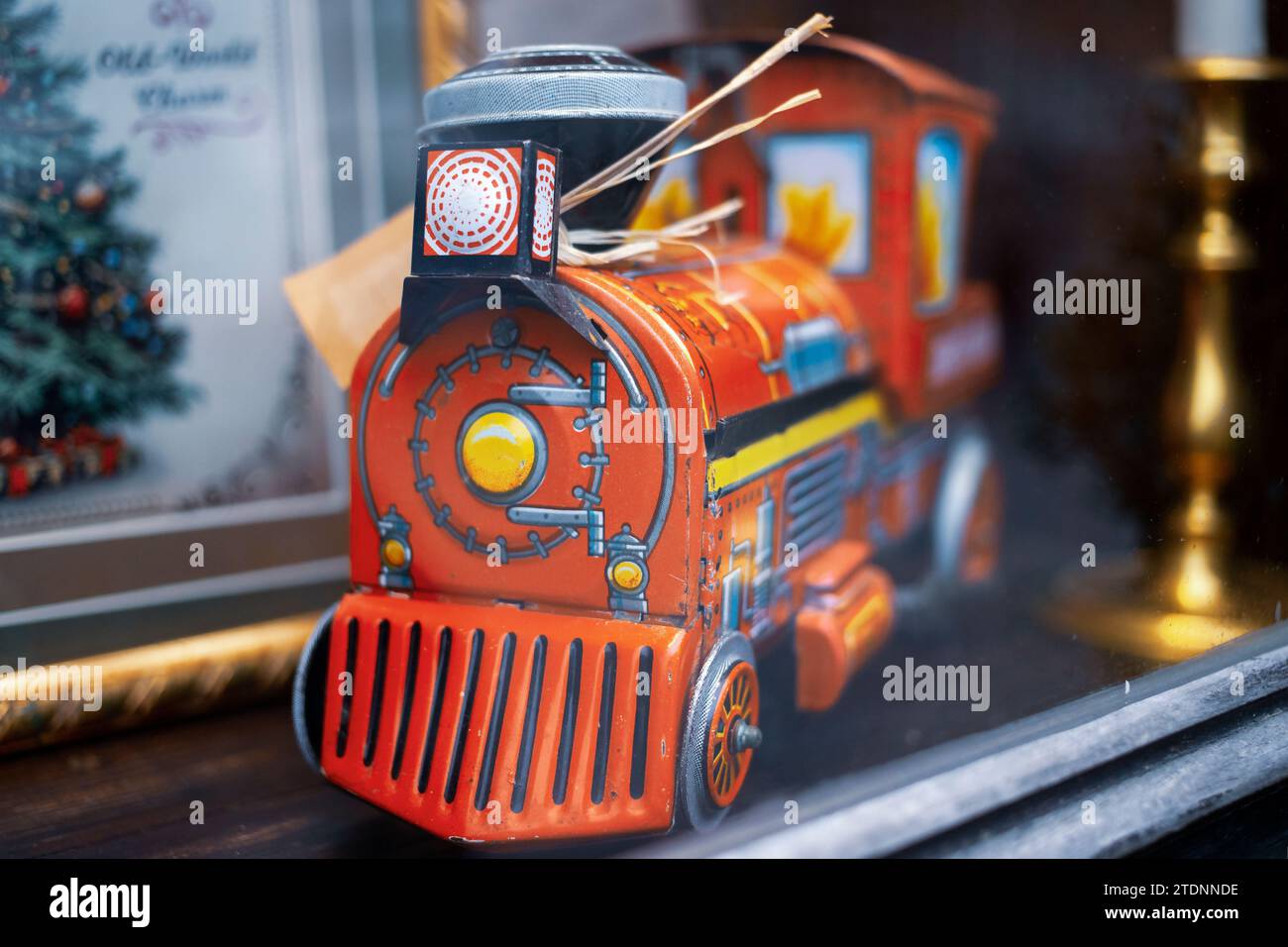 An antique steam locomotive toy decorating the shop window Stock Photo ...