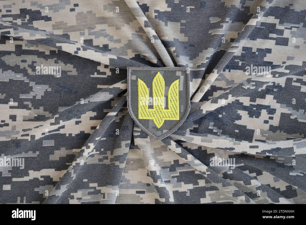 Symbol of Ukrainian army on the camouflage uniform of a Ukrainian ...