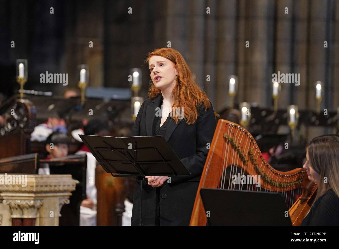 Hannah Rarity (left) singing with Ciorstaidh Beaton playing the harp ...
