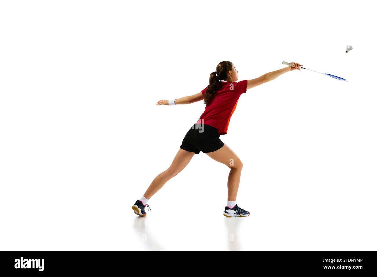 Full length portrait of badminton player demonstrates her skills in ...