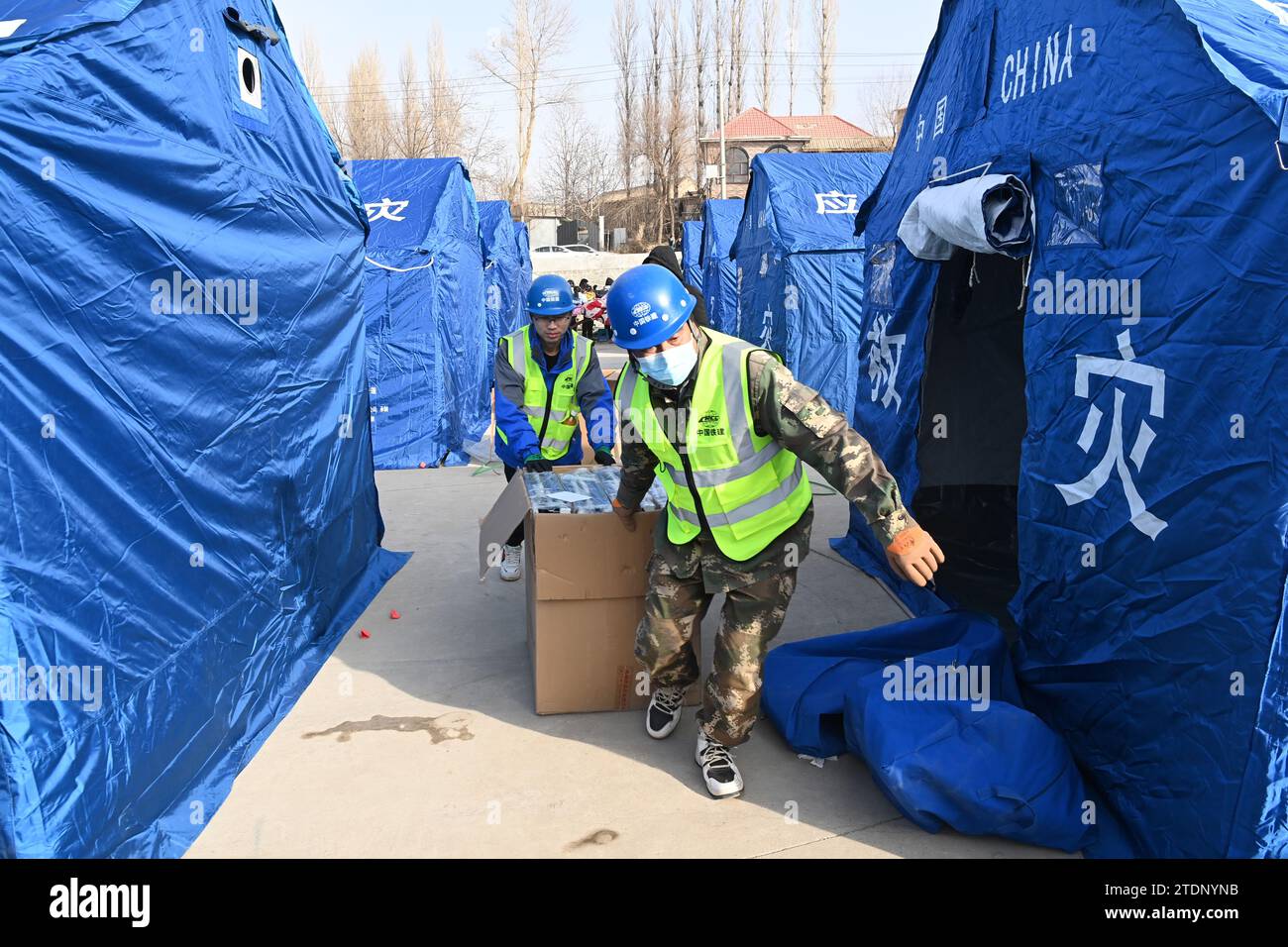 Jishishan, China. 19 December, 2023. Rescuers carry disaster relief ...