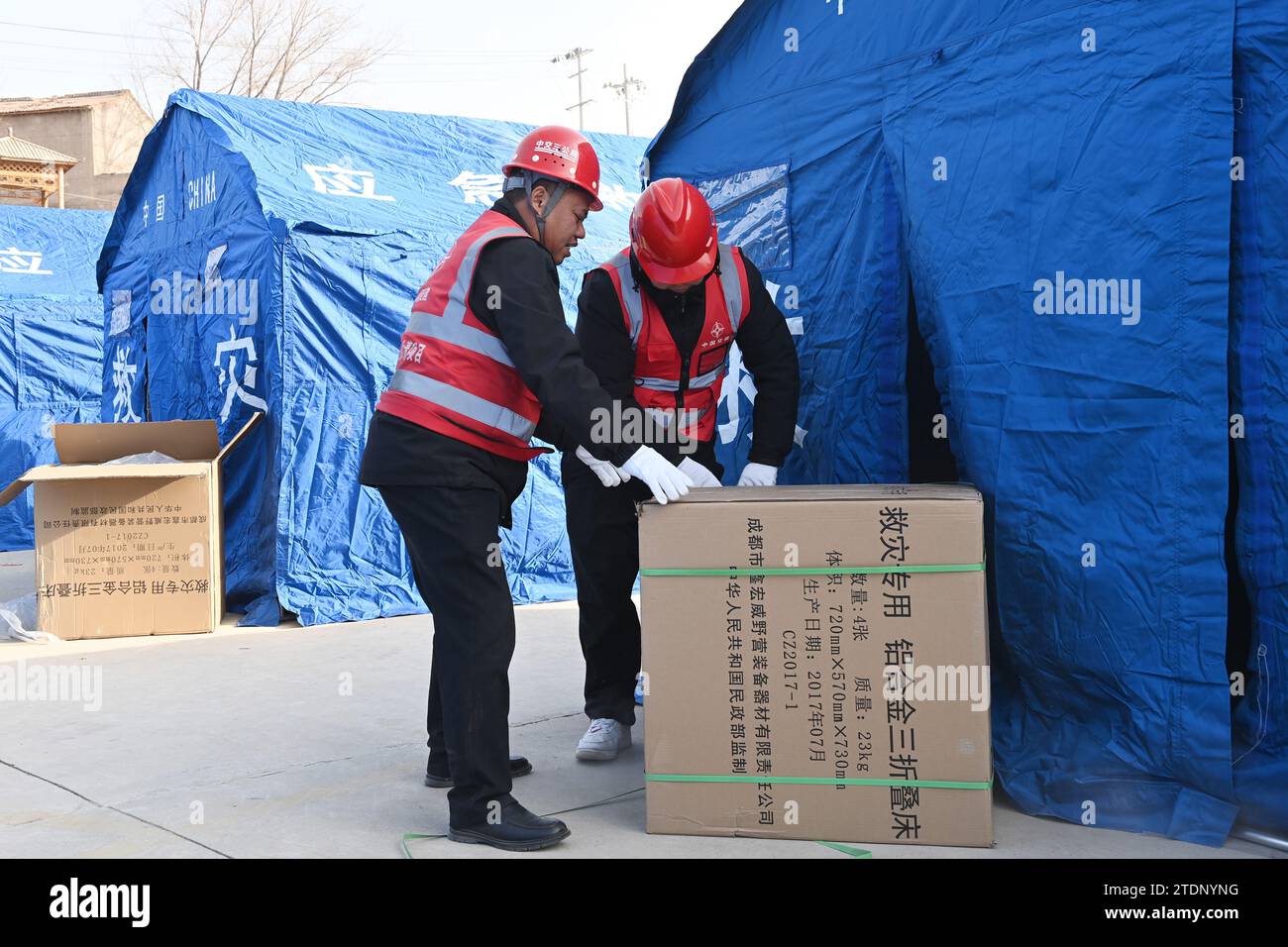 Jishishan, China. 19 December, 2023. Rescuers carry disaster relief ...