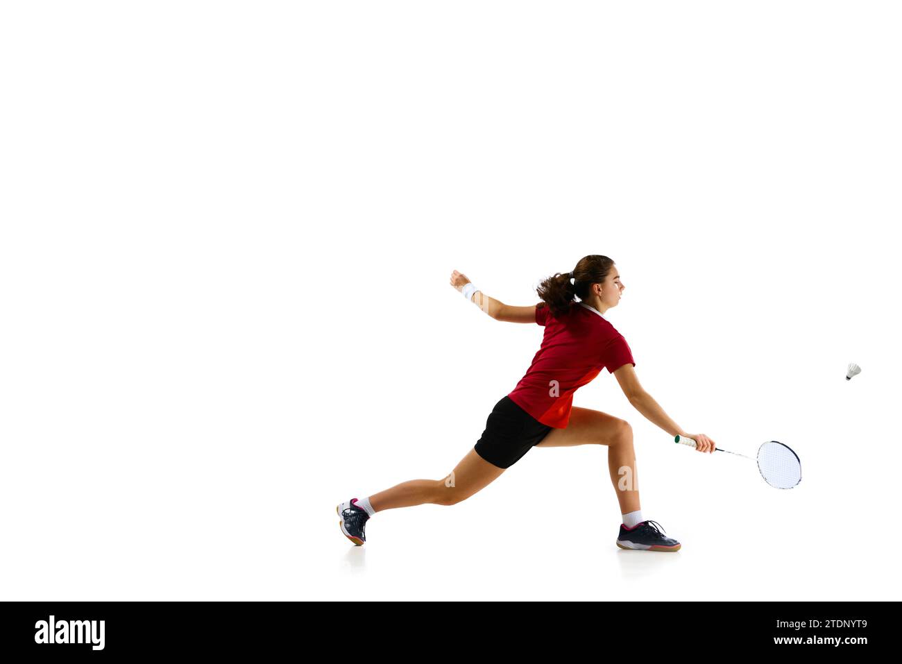Strength and power. Dynamic movements of professional badminton player practicing with intensity ...
