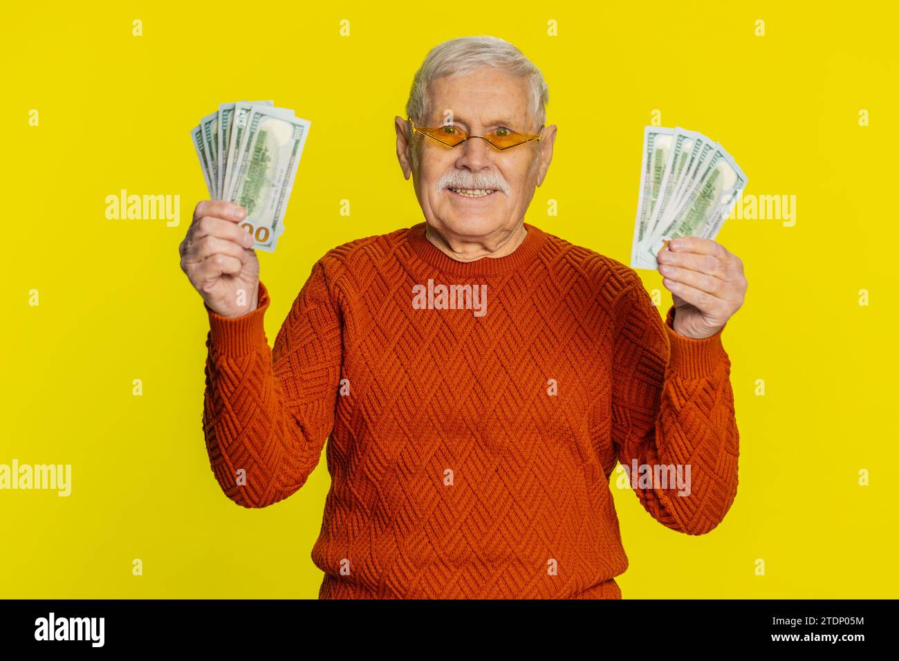 Senior old man holding fan of cash money dollar banknotes celebrate ...