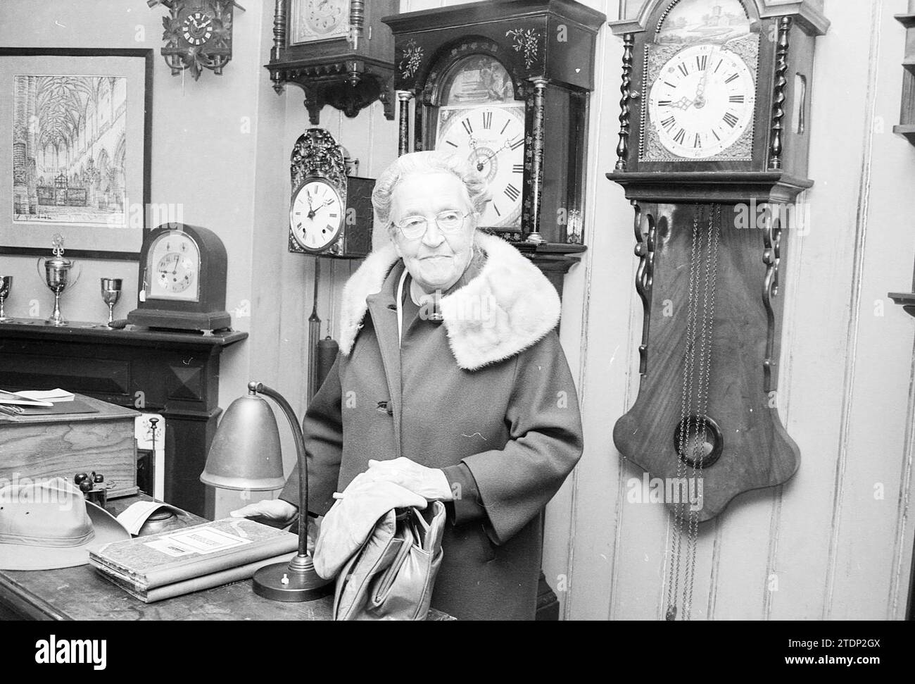 Corrie ten Boom (during filming Begijnenstraat) in the clock shop ...