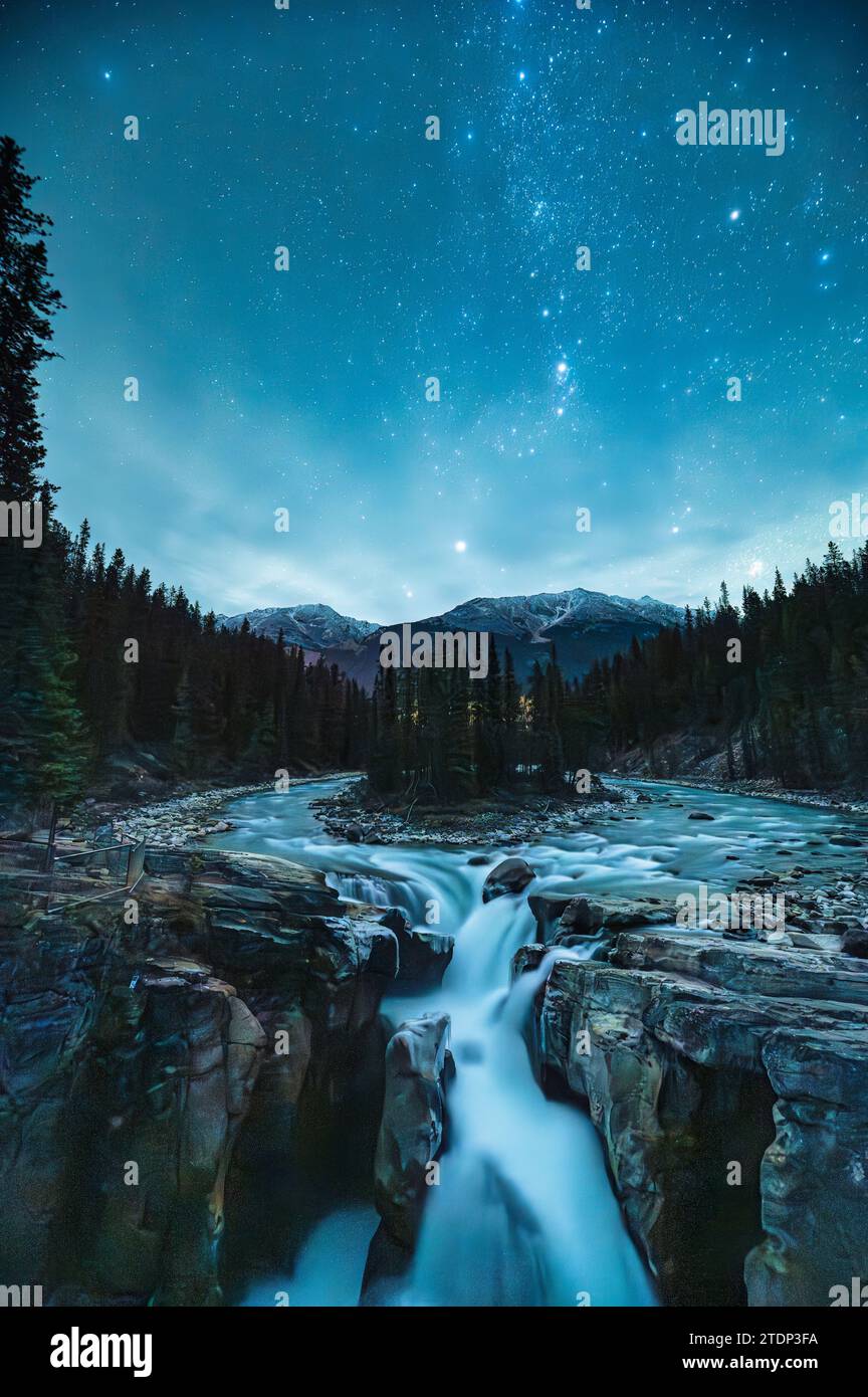 Night scene of Sunwapta Falls with glowing starry in the sky in ...