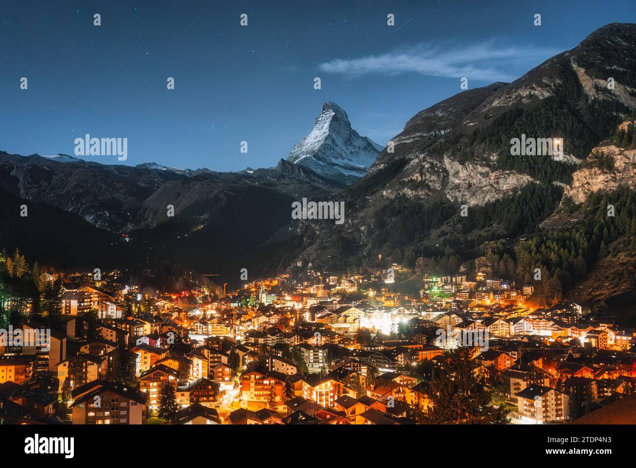 Beautiful viewpoint of Zermatt village with light glowing and ...