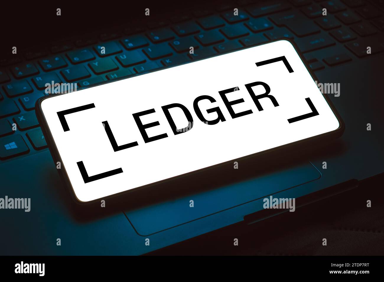 In this photo illustration, the Ledger logo is displayed on a ...