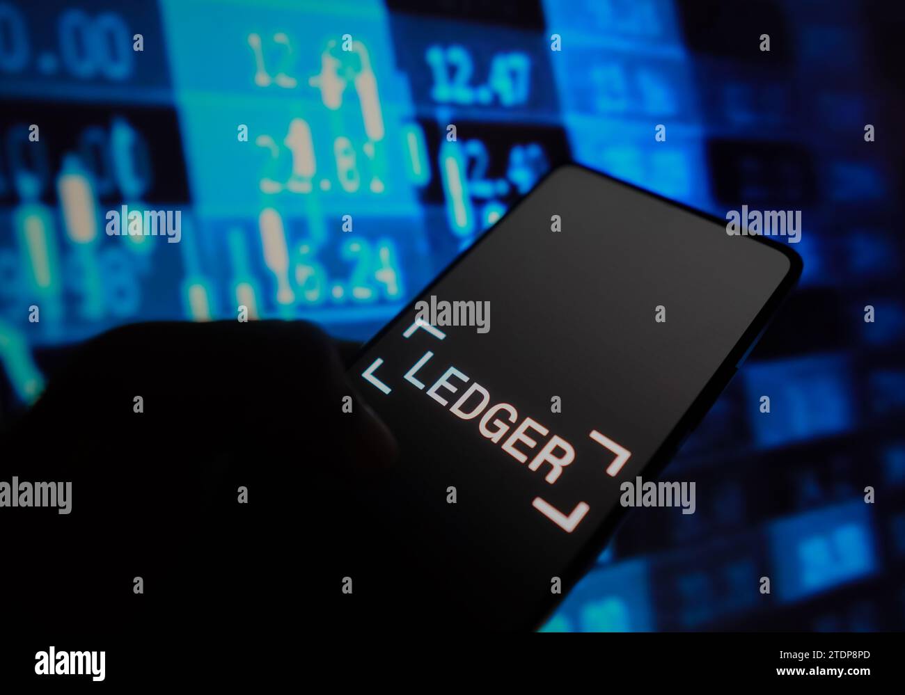 In this photo illustration, the Ledger logo is displayed on a ...