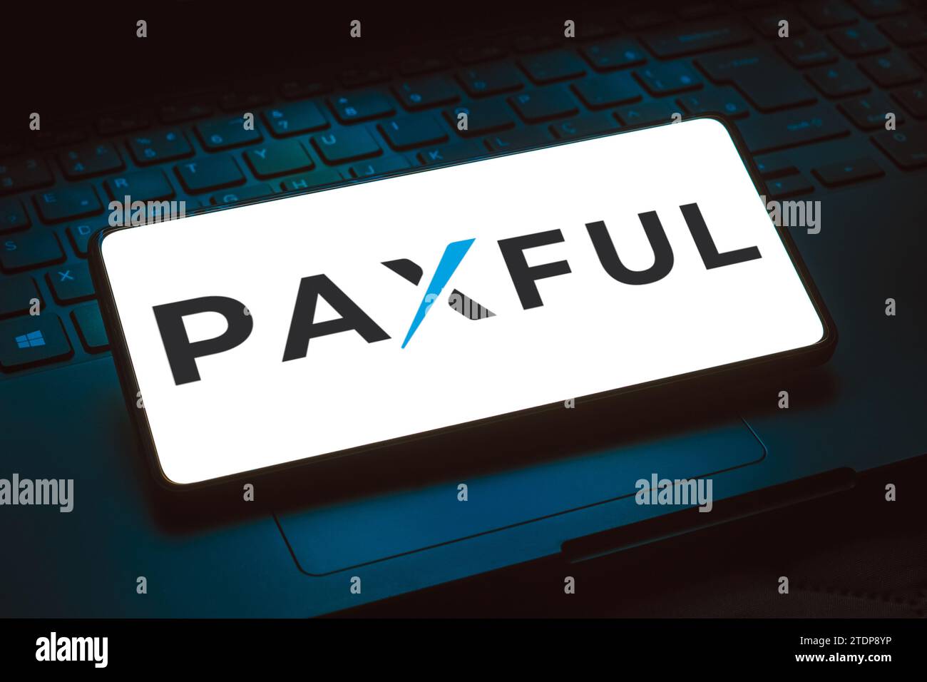 In this photo illustration, the Paxful logo is displayed on a ...
