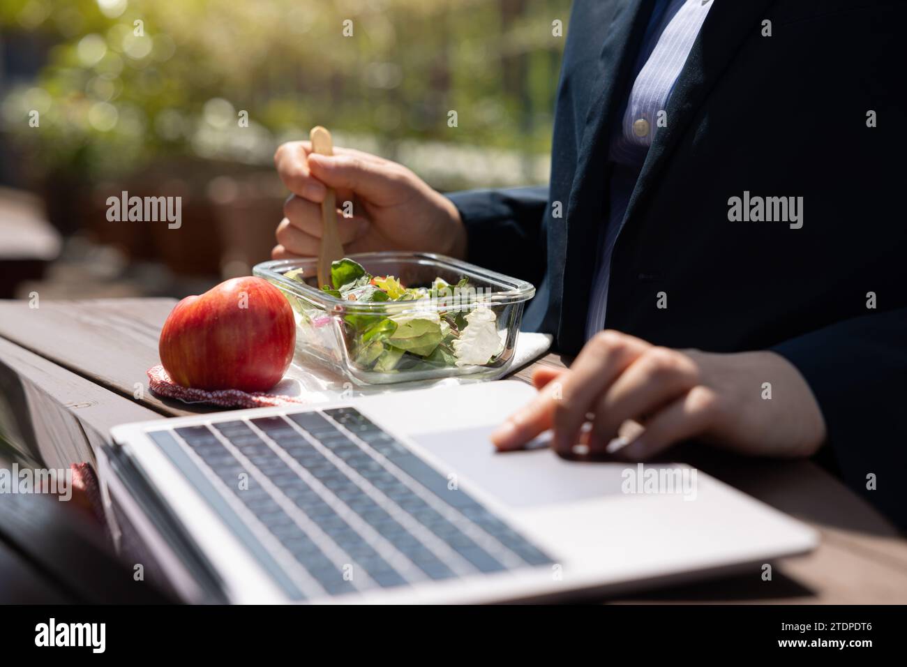 A female office worker is having a lunch break alone at work Stock ...