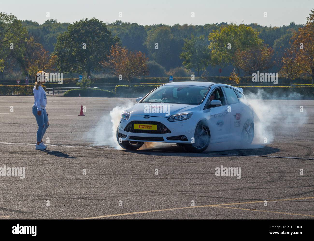 Stunt driver Paul Swift driving his Ford Focus on 2 wheels and Mustang ...