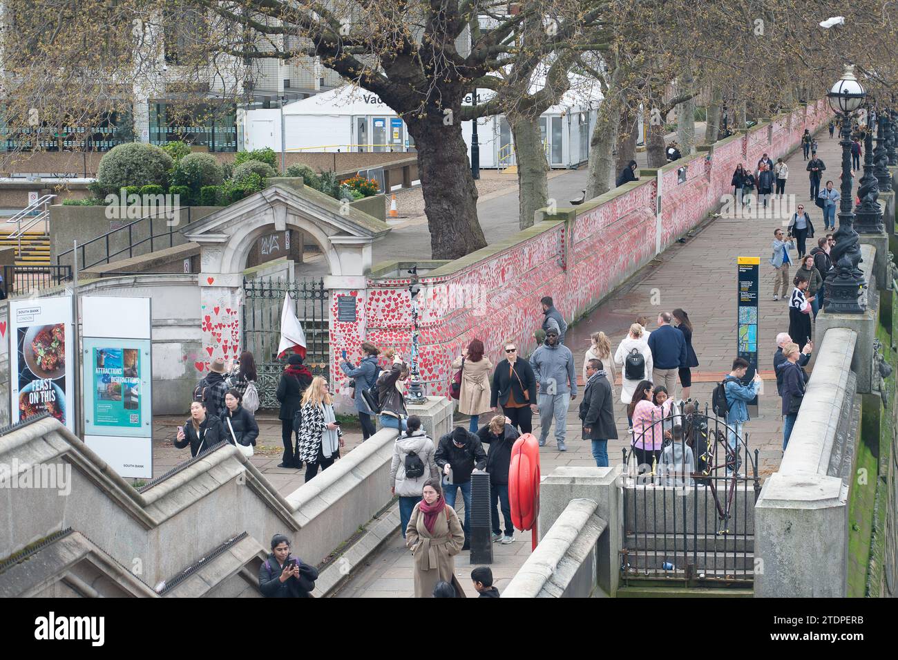 London, UK. 11th April, 2023. People walk past the Covid-19 Memorial ...