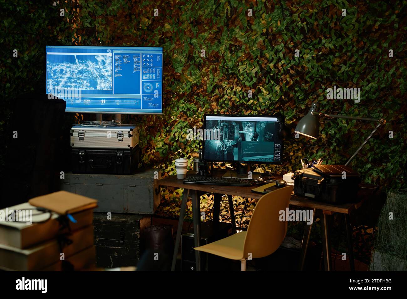 Low key shot of workplace of military officer with table lamp and two ...