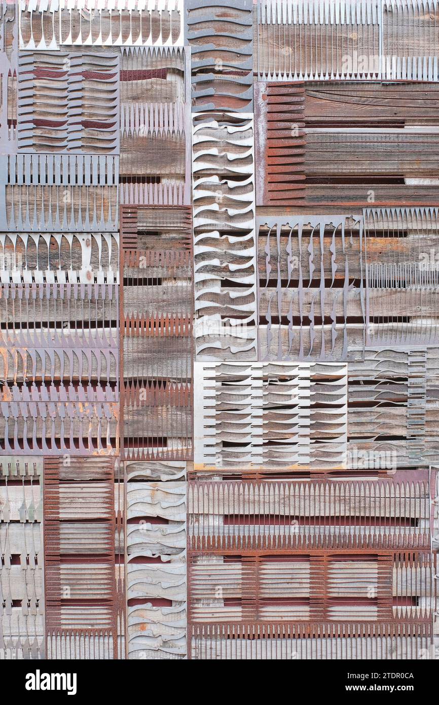 Abstract metal background with perforations in shape of various knives ...