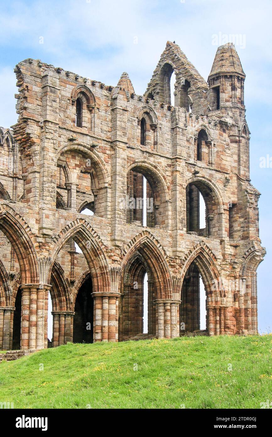 A view of Whitby Abbey in Yorkshire with its ruined windows, columns ...