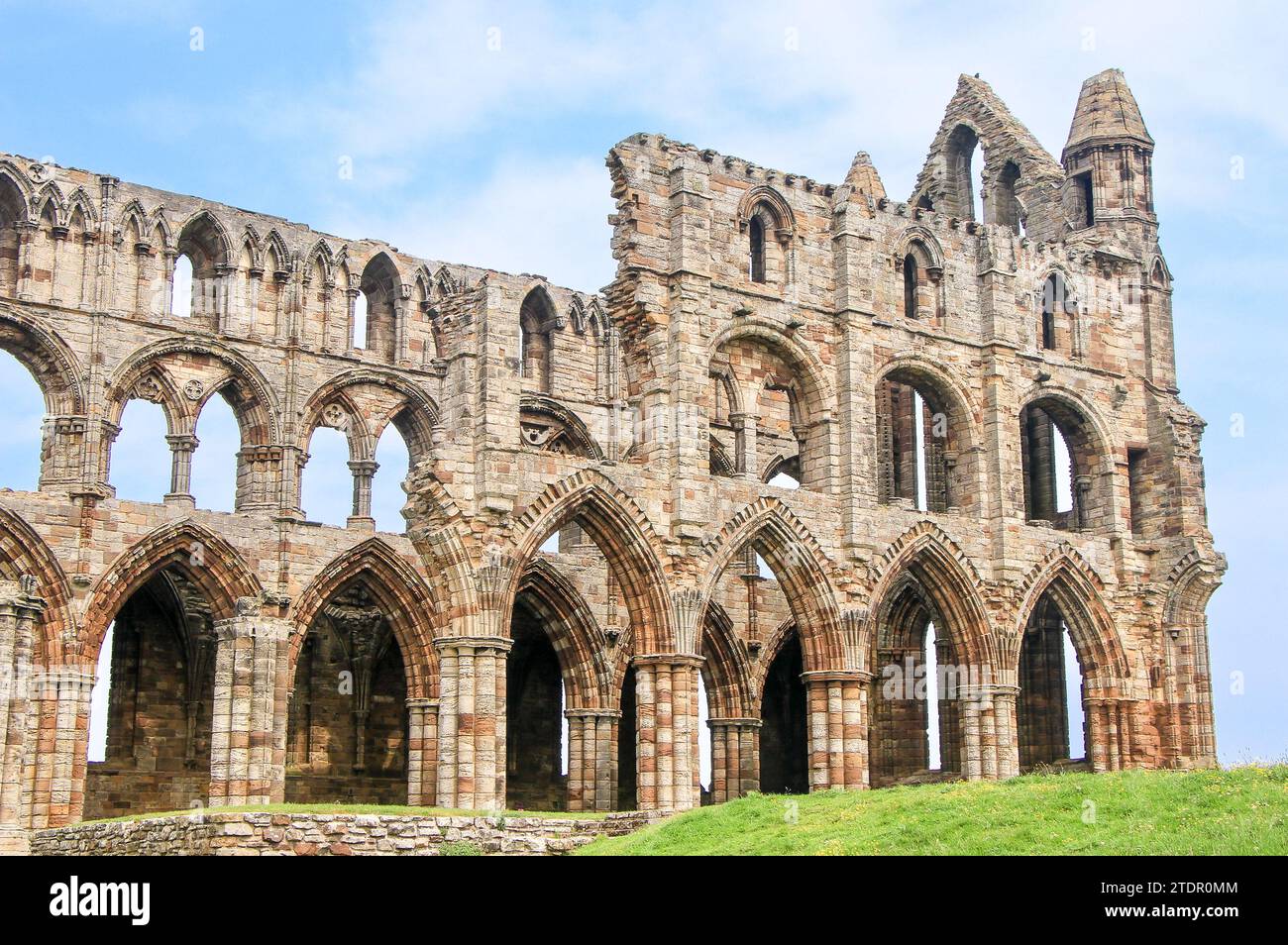 A view of Whitby Abbey in Yorkshire with its ruined windows, columns ...