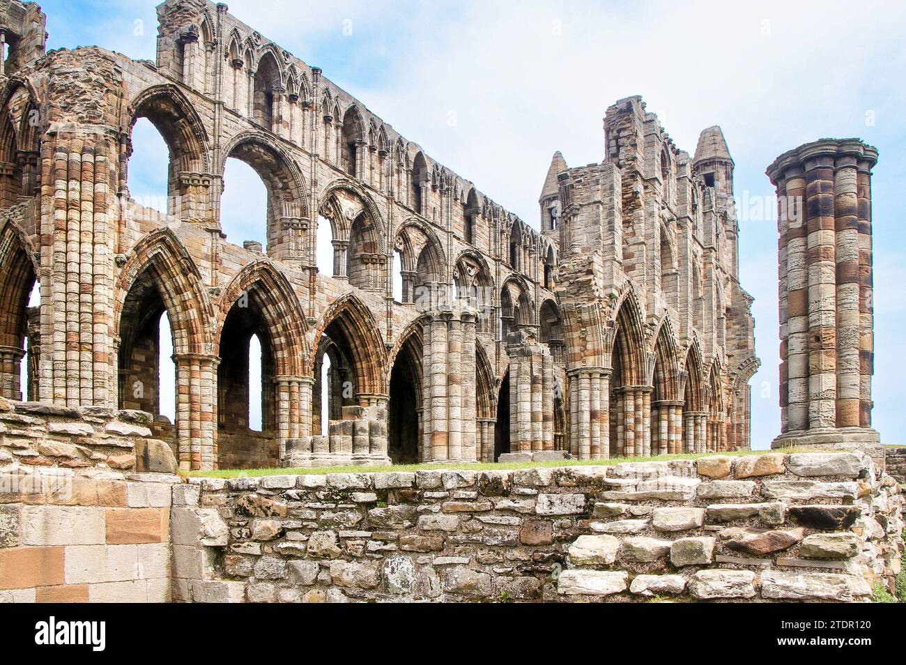 A view of Whitby Abbey in Yorkshire with its ruined windows, columns ...