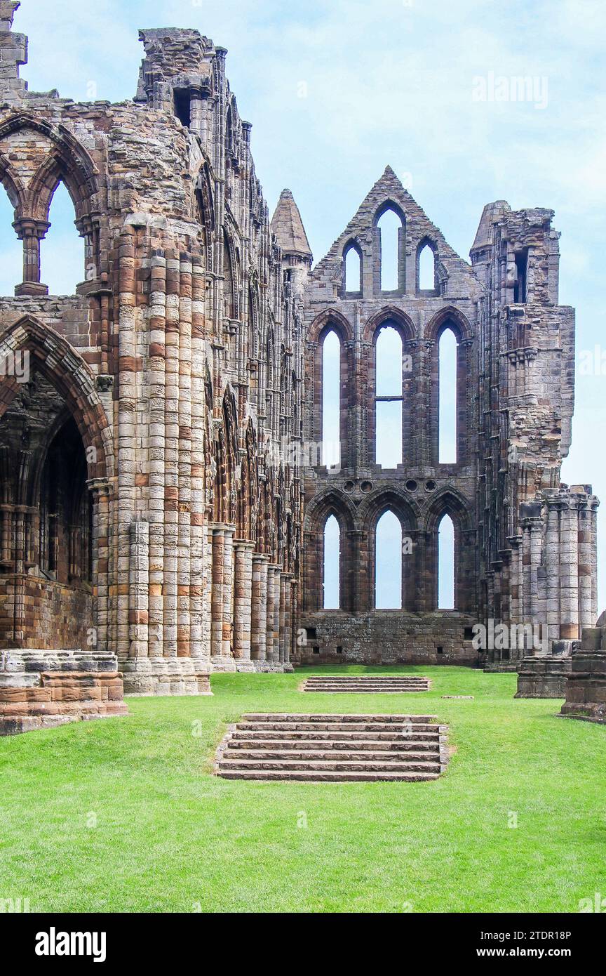A view of Whitby Abbey in Yorkshire with its ruined windows, columns ...
