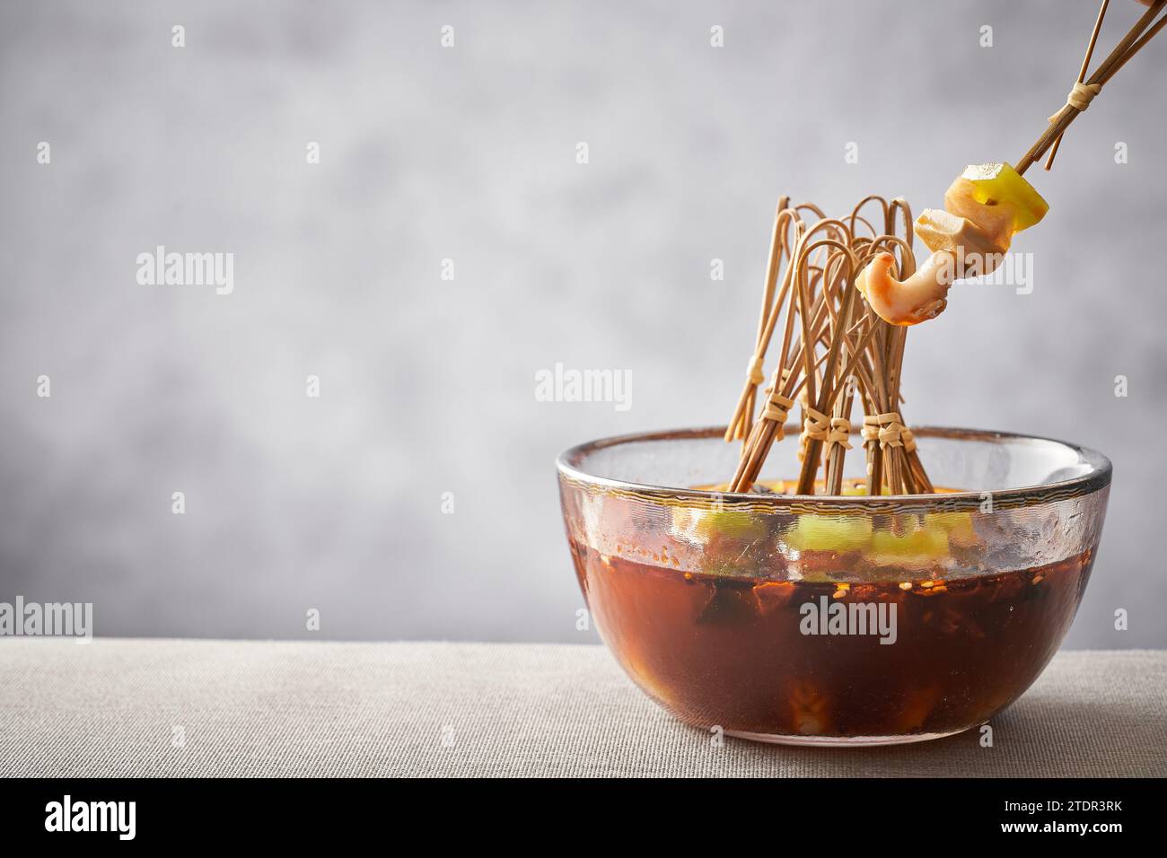 Sea Snails skewer in spicy soup Stock Photo - Alamy
