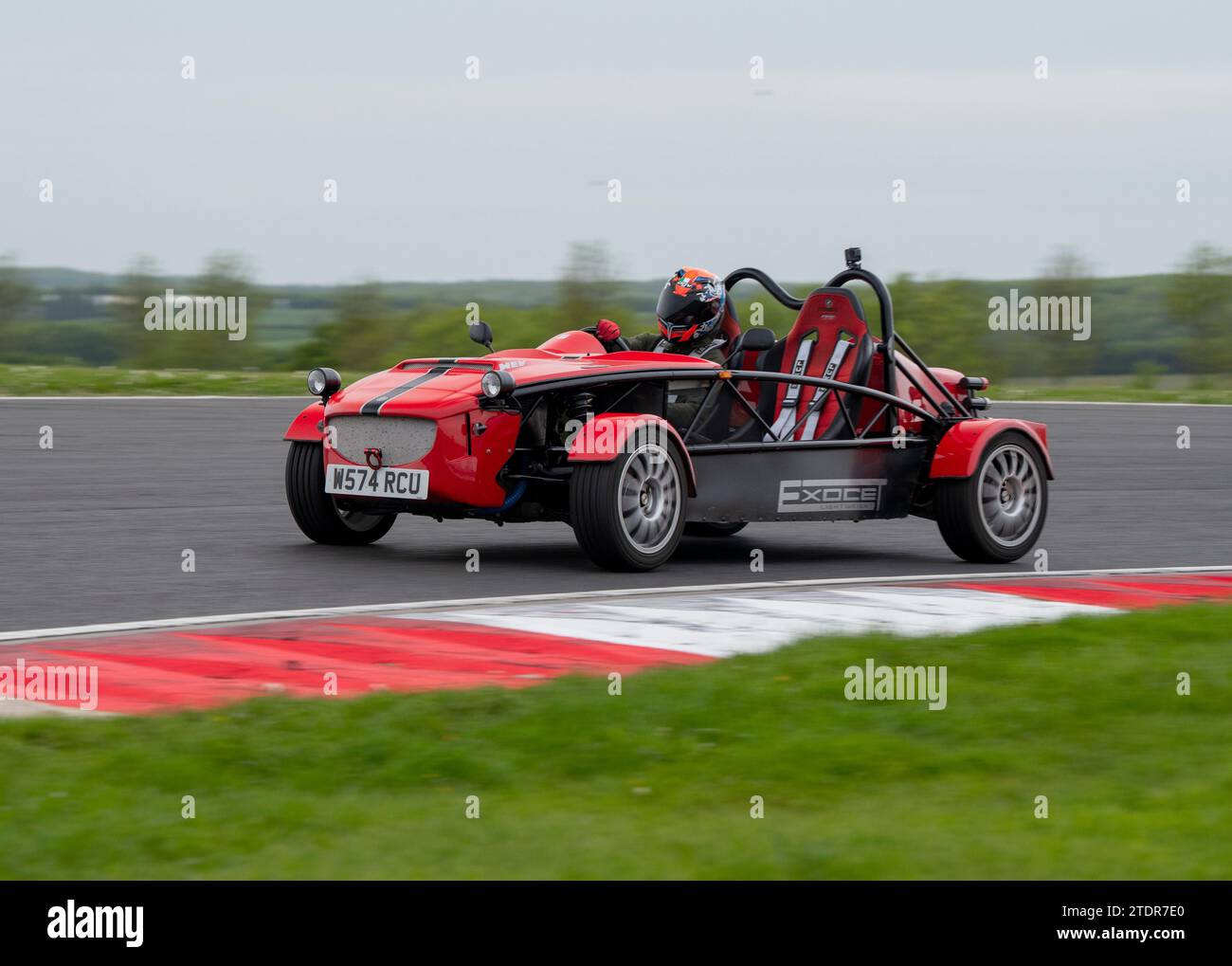 Exocet sports car driving fast on track during a race track day event ...
