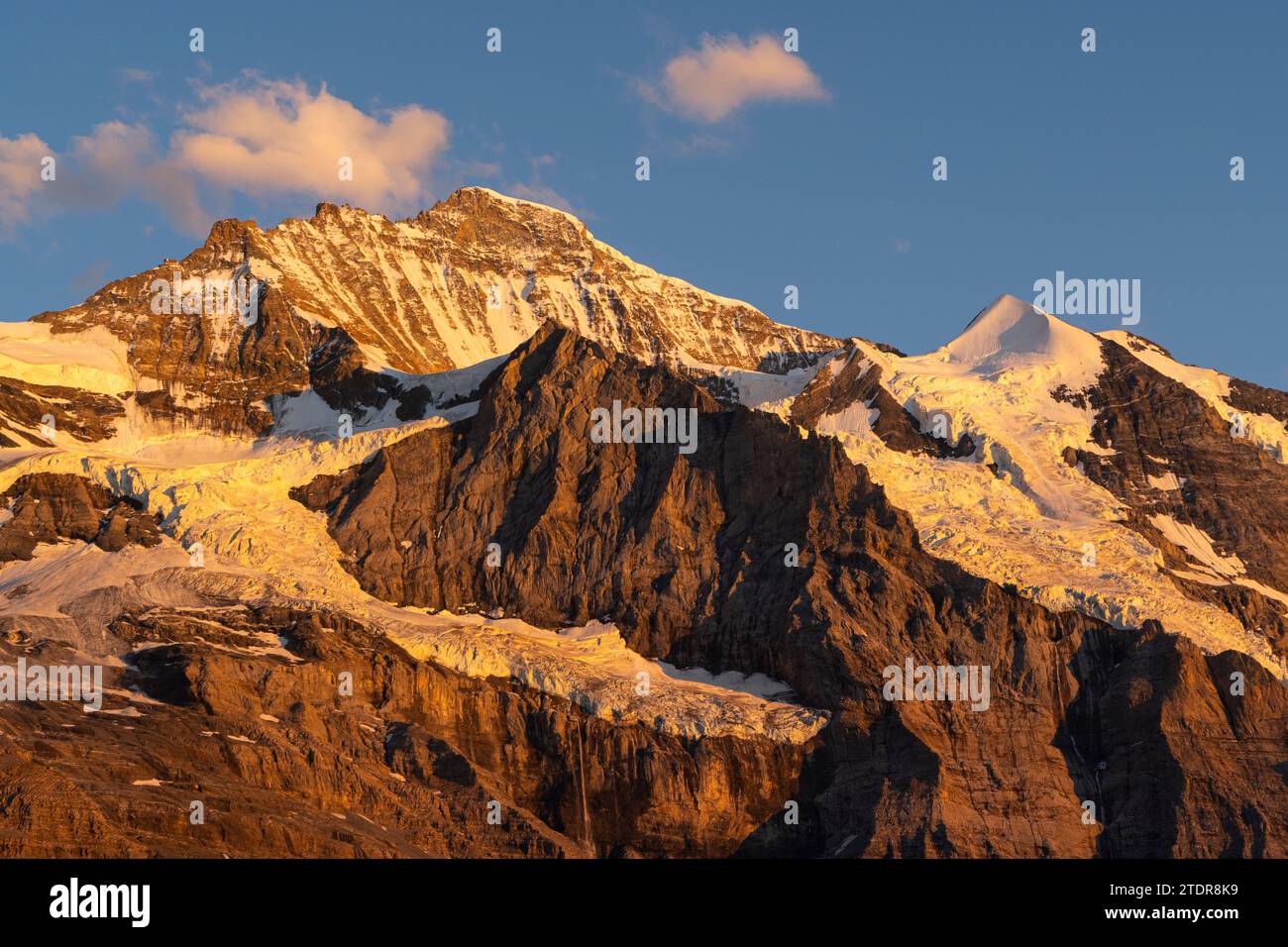 Waterfall below the Jungfrau in alpenglow, Bernese Oberland ...