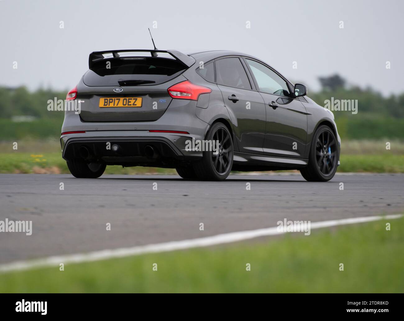 driving fast on track during a race track day event Stock Photo - Alamy