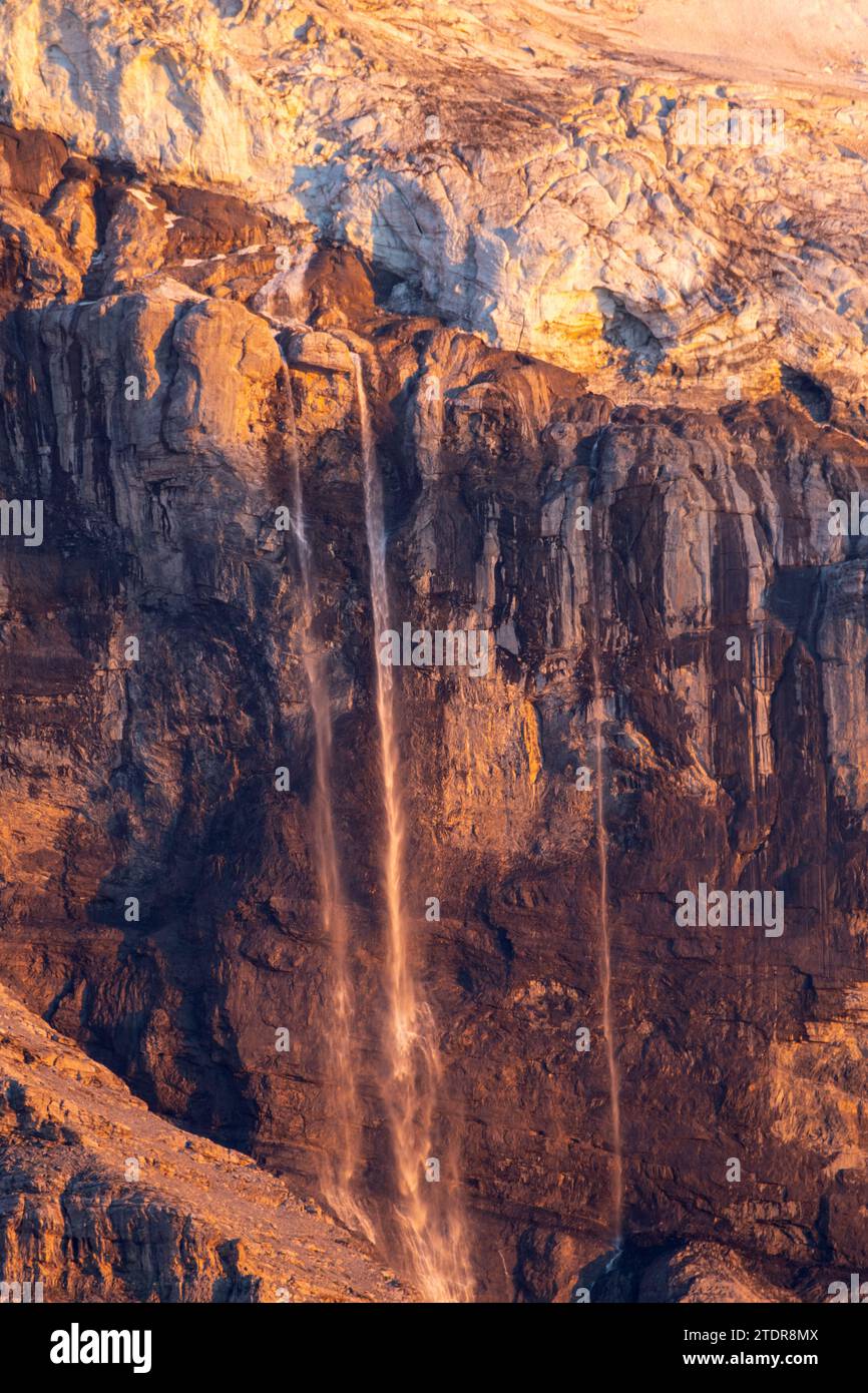 Waterfall below the Jungfrau in alpenglow, Bernese Oberland ...