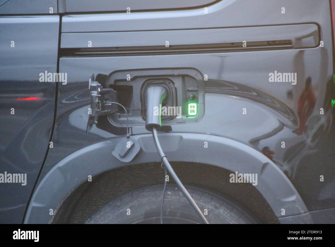 Paredes, Spain, December 19, 2023: The charging hose in a vehicle ...