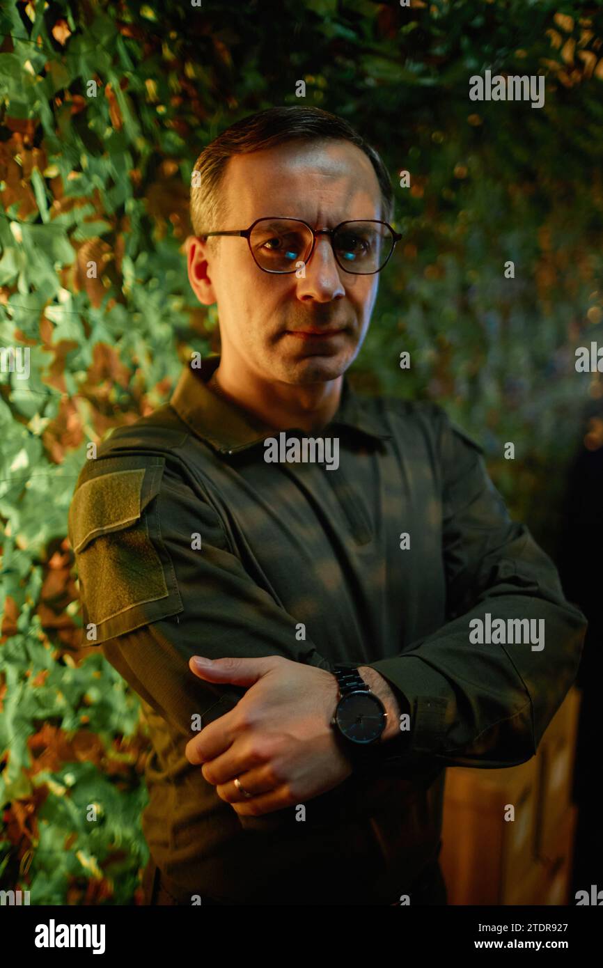 Confident mature male security officer in eyeglasses and uniform ...
