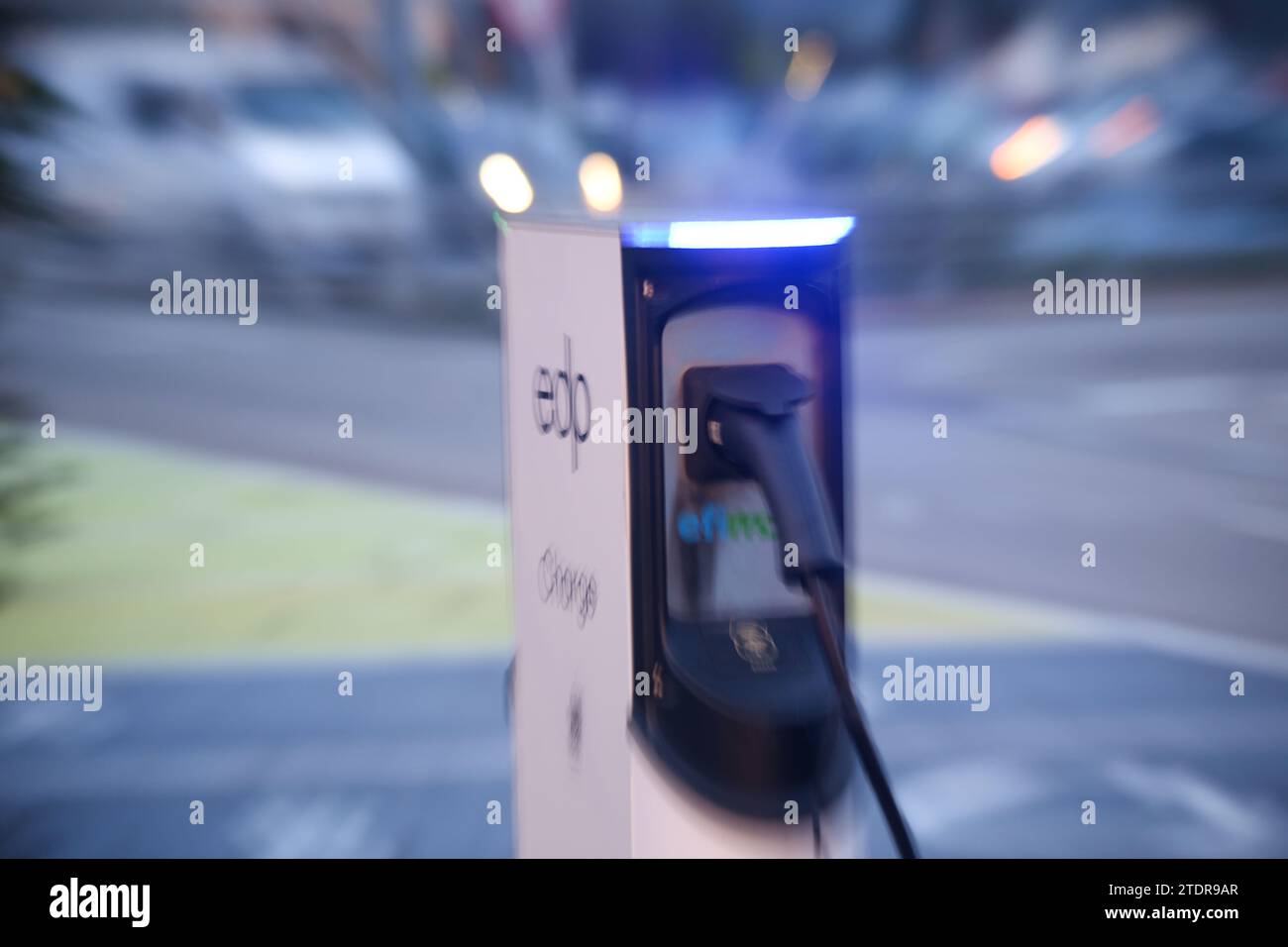 Paredes, Spain, 19th December, 2023: The charging hose plugged into the ...