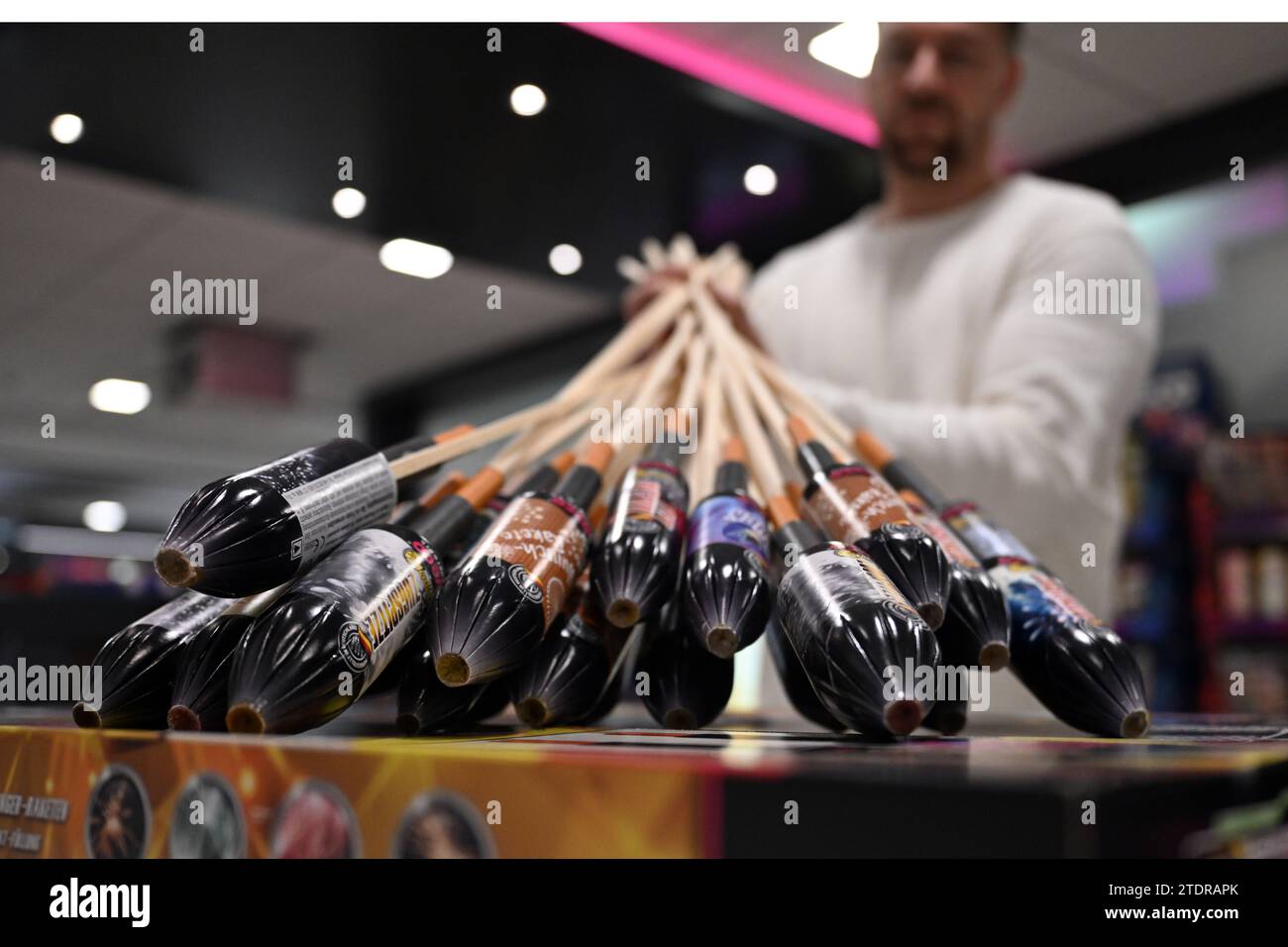 Eitorf, Germany. 19th Dec, 2023. An employee holds New Year's Eve ...