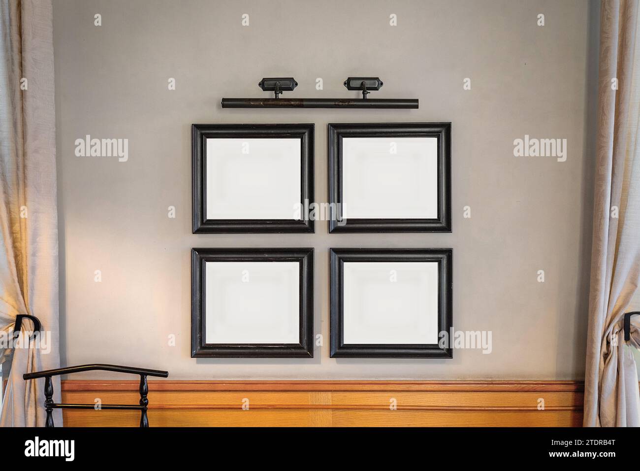 Mockup with 4 frames for a painting or photograph in the wall between ...