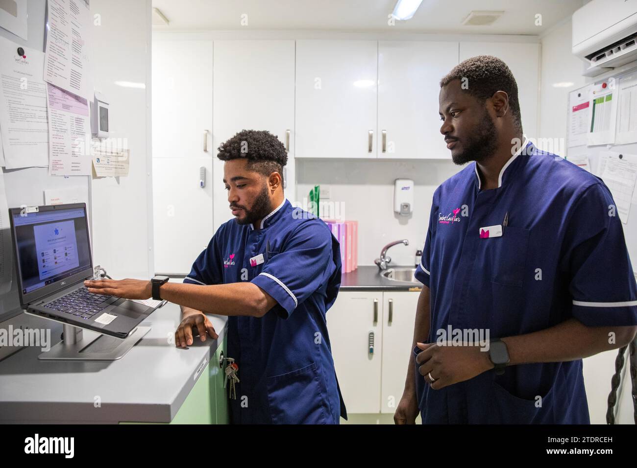 Nurse Evans Sarbeng in the treatment room with fellow Nurse John Haizel ...