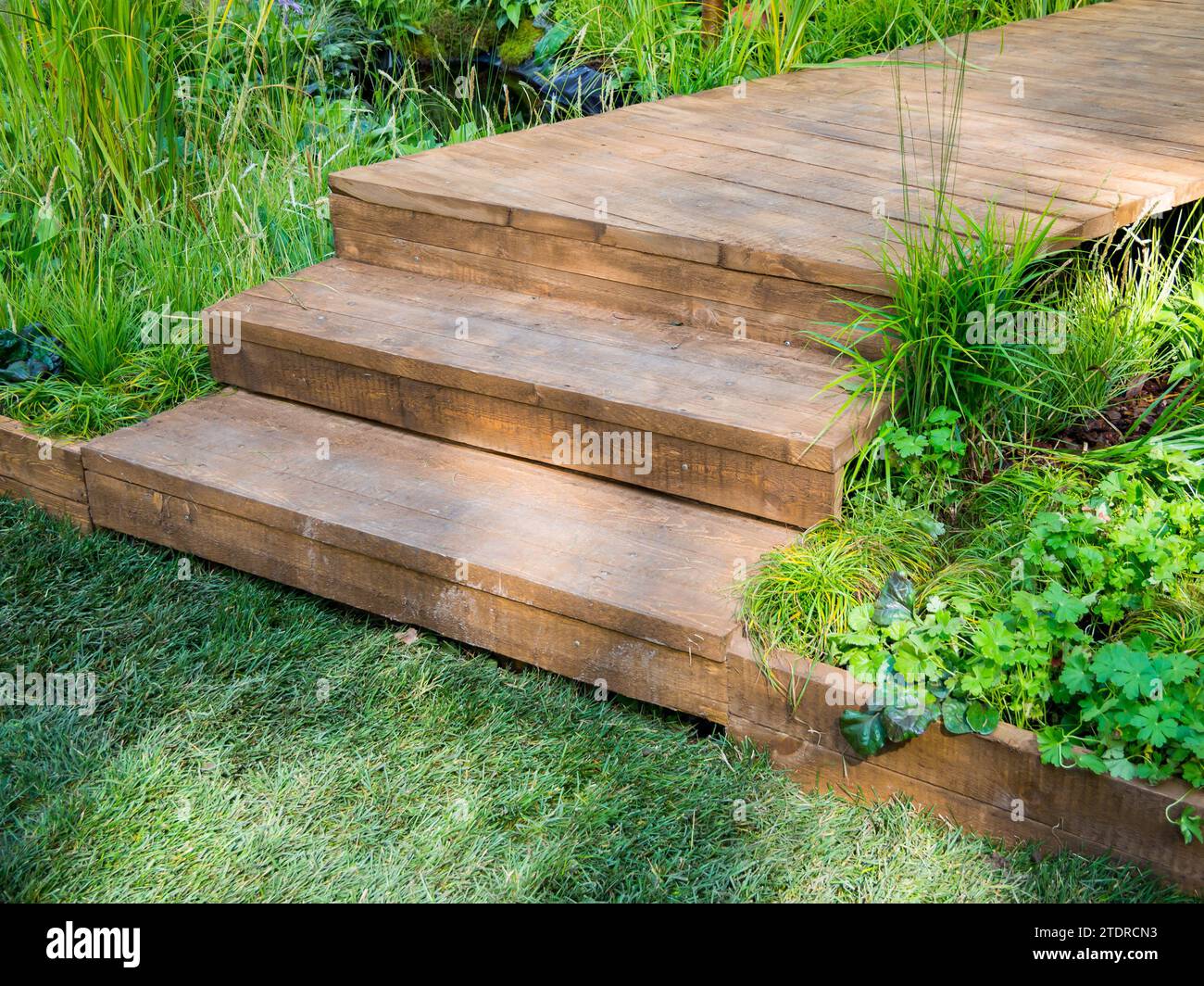 Steps and raised wooden deck Stock Photo - Alamy