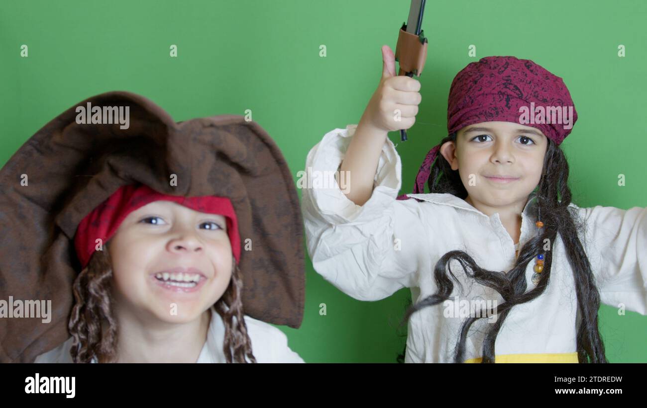Cute children playing pirates. preschool boy making funny face ...