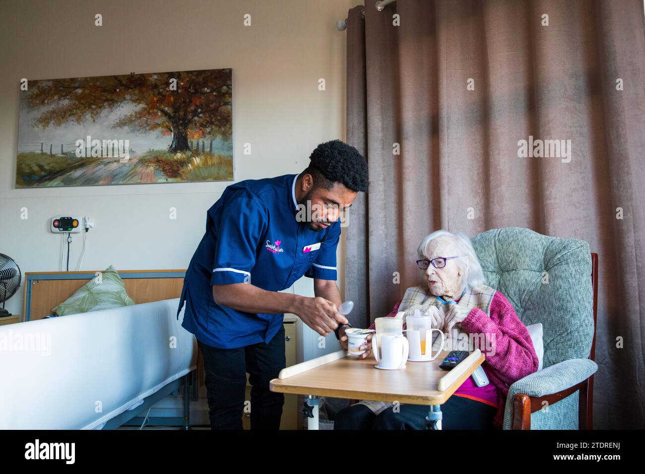 Ghanaian Nurse Evans Sarbeng with resident Phyllis Padham (97) at St ...