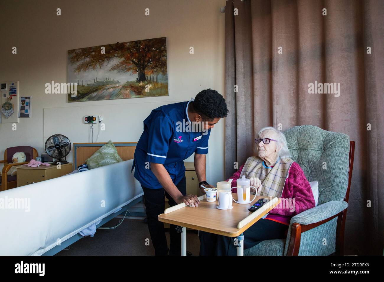 Ghanaian Nurse Evans Sarbeng with resident Phyllis Padham (97) at St ...