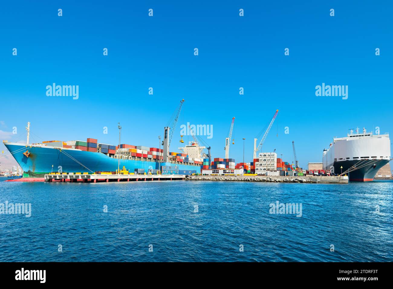 Containers being loaded / Unloaded in a cargo ship at the port of ...
